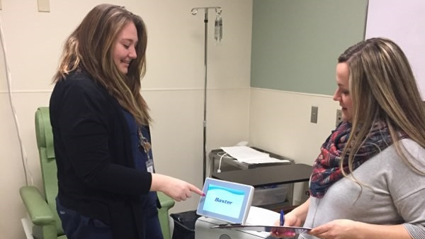 Women looking at SHARESOURCE two-way telehealth platform | Baxter